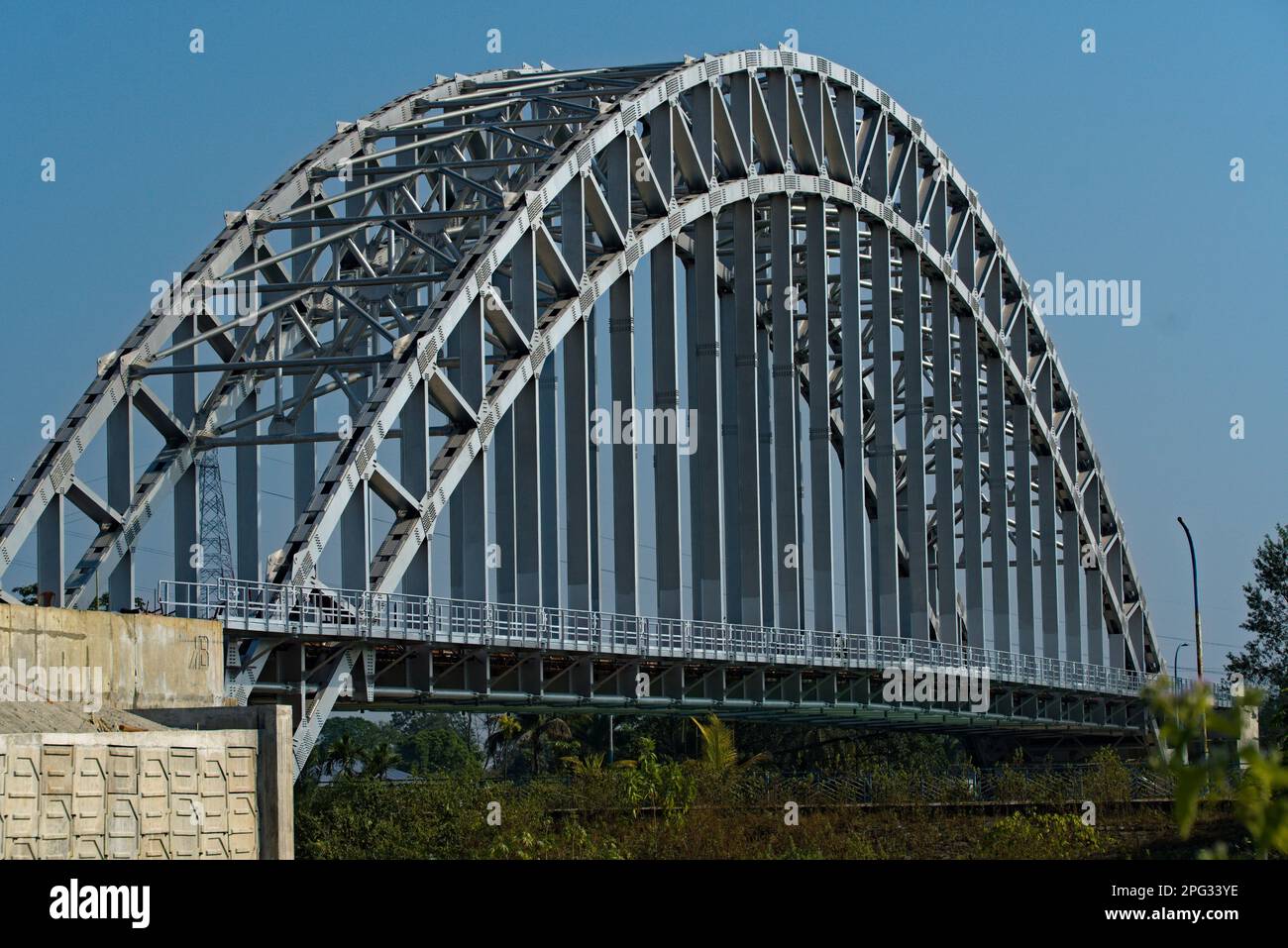 arch shaped road bridge over the river canal Stock Photo - Alamy