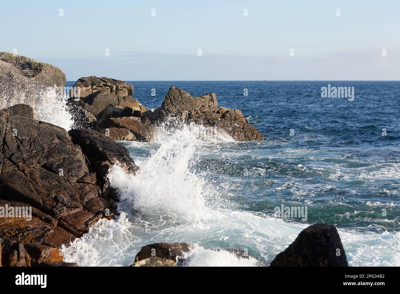 Isles of Scilly, Peninnis Head - Waves crashing onto rocks Stock Photo ...
