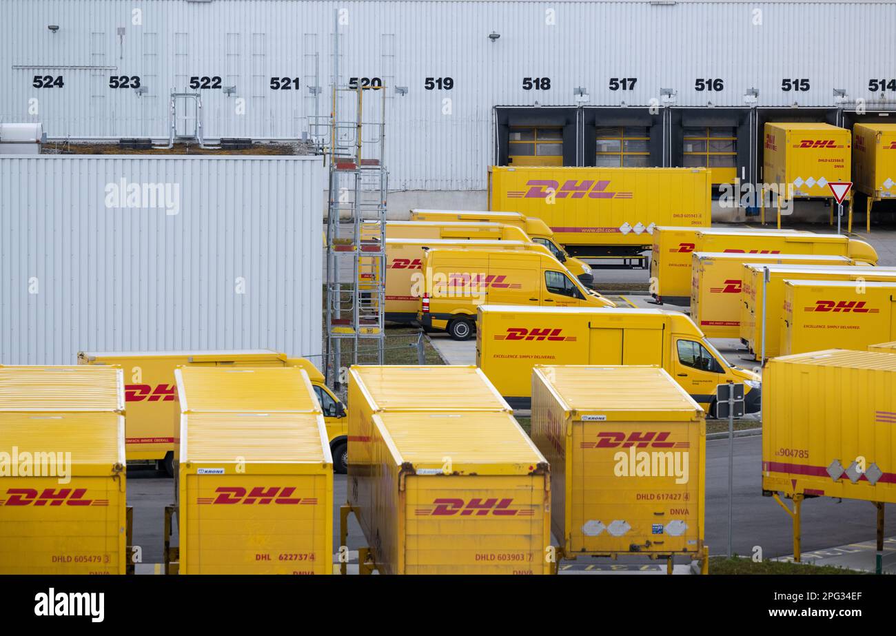 Aschheim, Germany. 20th Mar, 2023. Containers and vehicles with the DHL ...