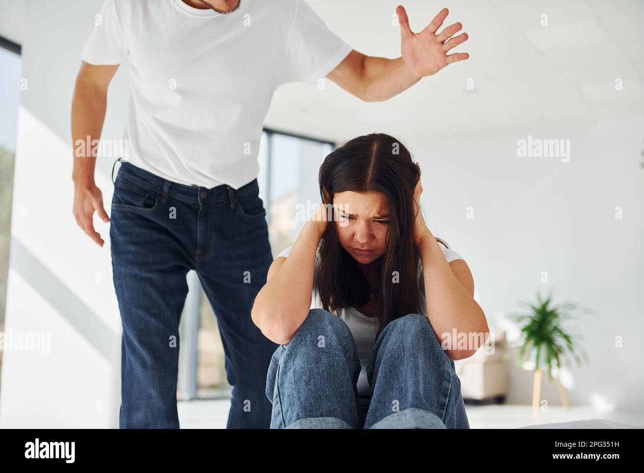 Violent aggressive young man threatening his girlfriend at home Stock ...