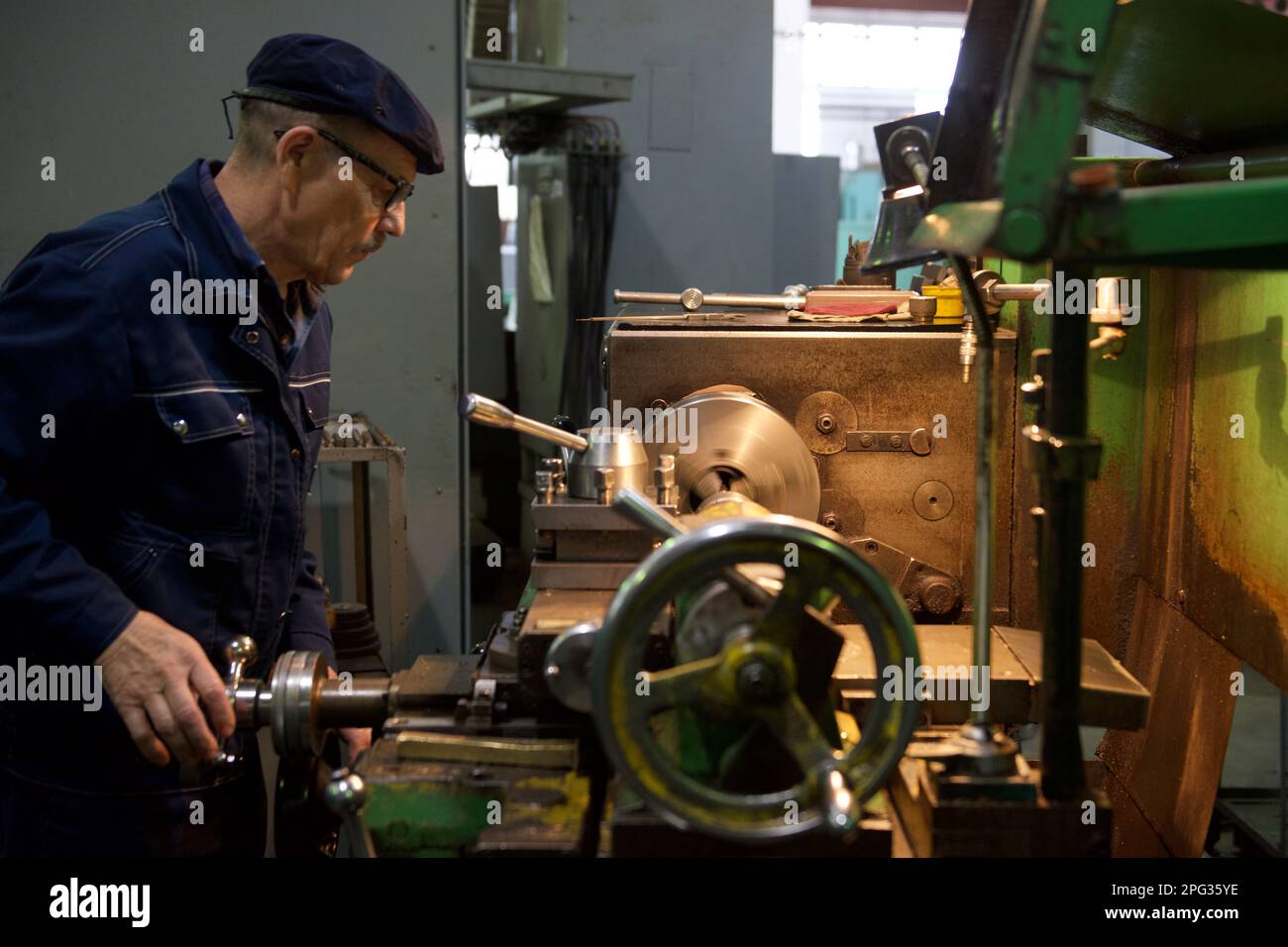 an old worker at a lathe Stock Photo - Alamy