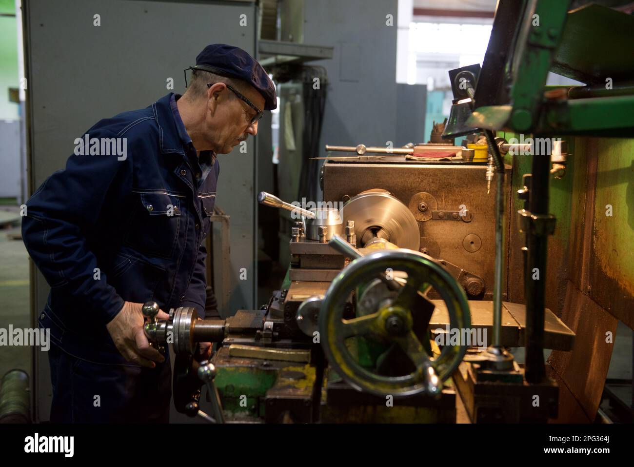 an old worker at a lathe Stock Photo - Alamy