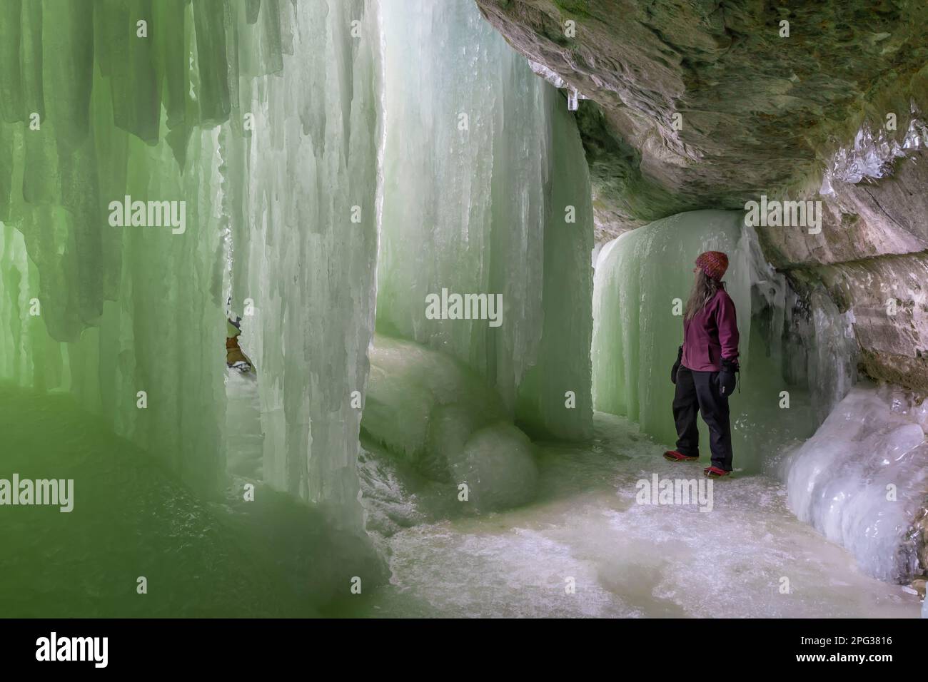 Karen Rentz behind the spectacular ice formations of Eben Ice Caves ...