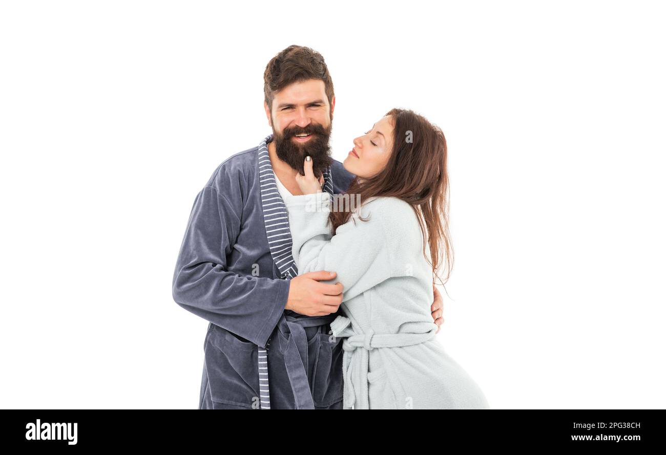 Sleepy woman touch beard of happy family man in robes isolated on white ...