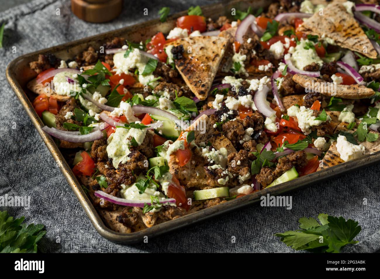 Mediterranean Homemade Pita Nachos with Lamb Hummus Feta and Cucumber ...