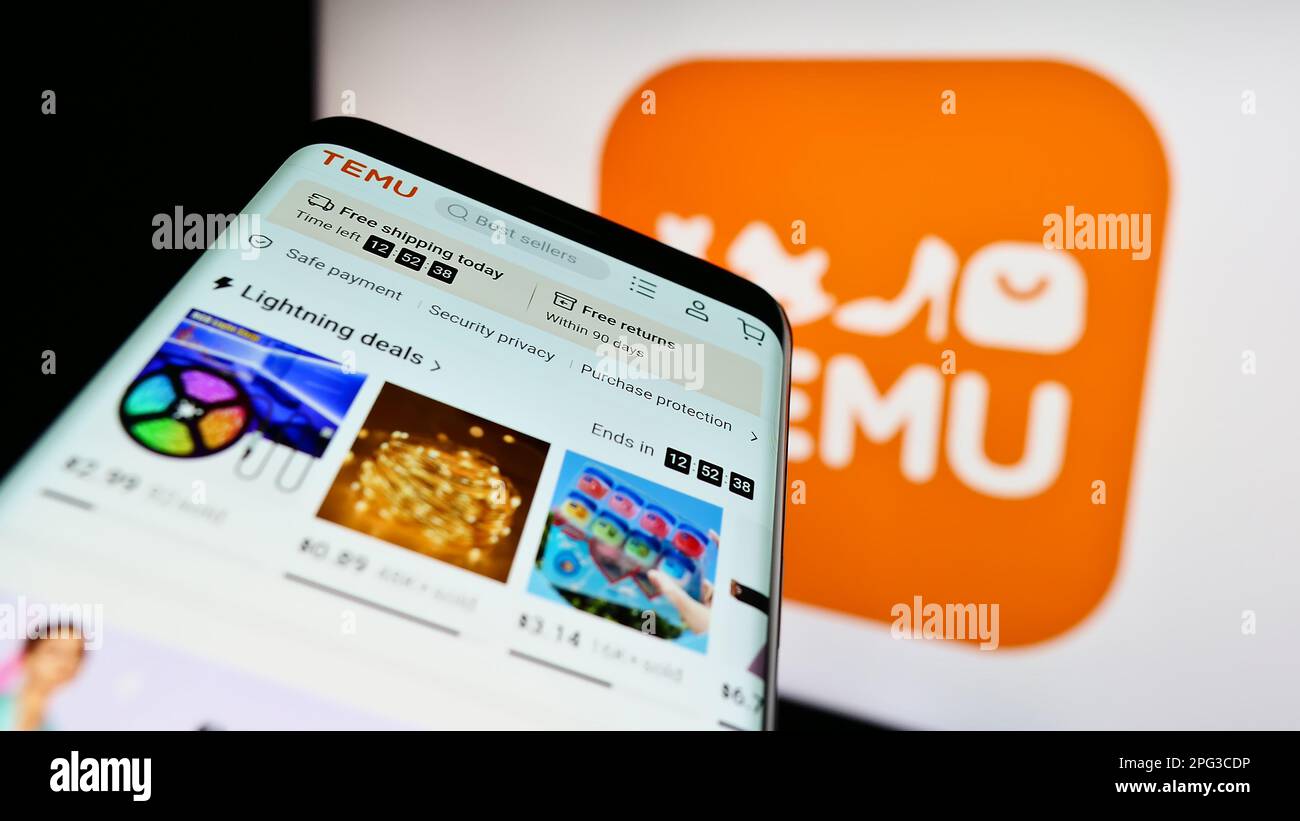 Smartphone with webpage of US online shop company Temu on screen in ...