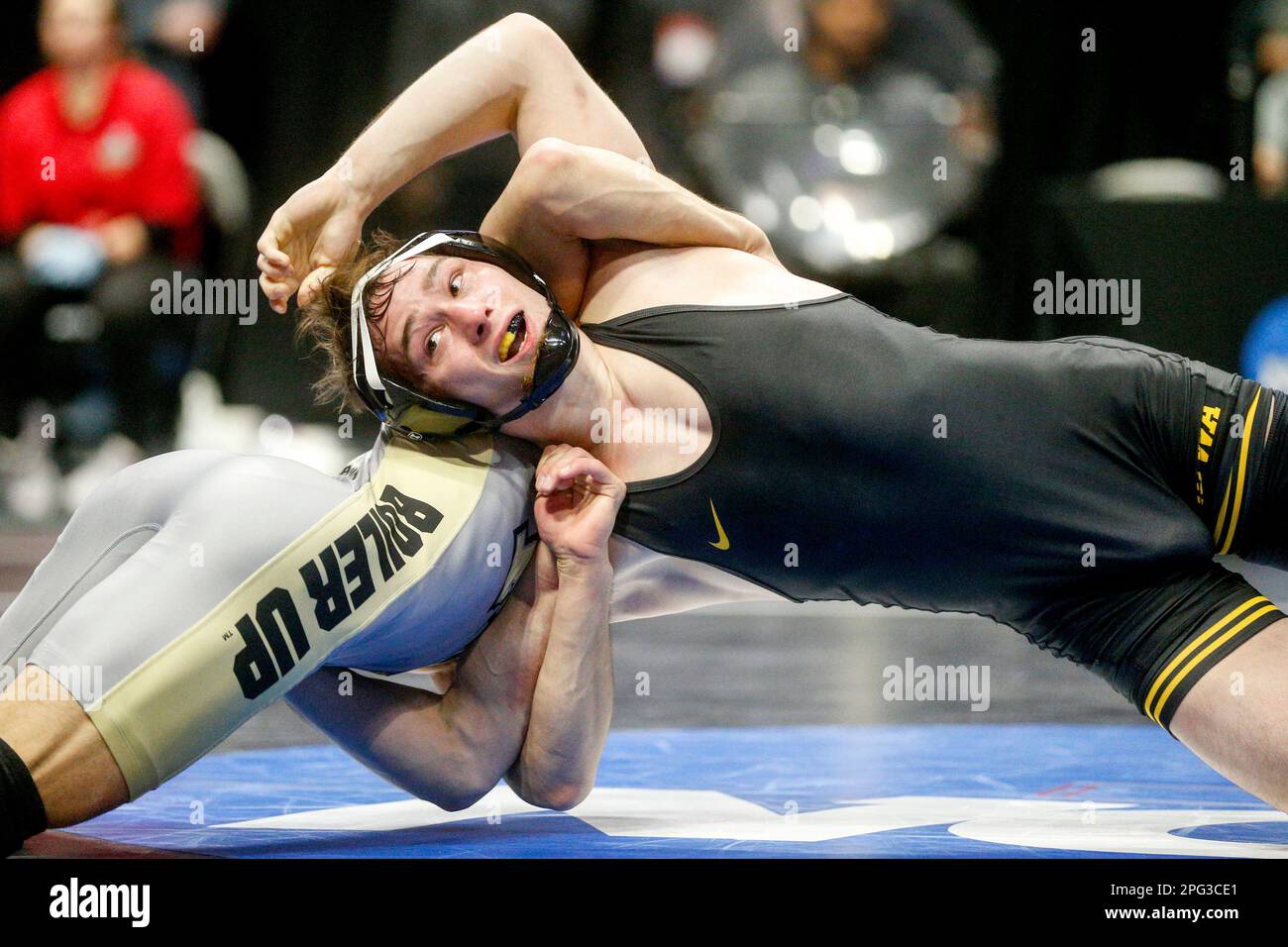Purdue's Matt Ramos throws Iowa's Spencer Lee during the semifinal round of the NCAA Wrestling ...