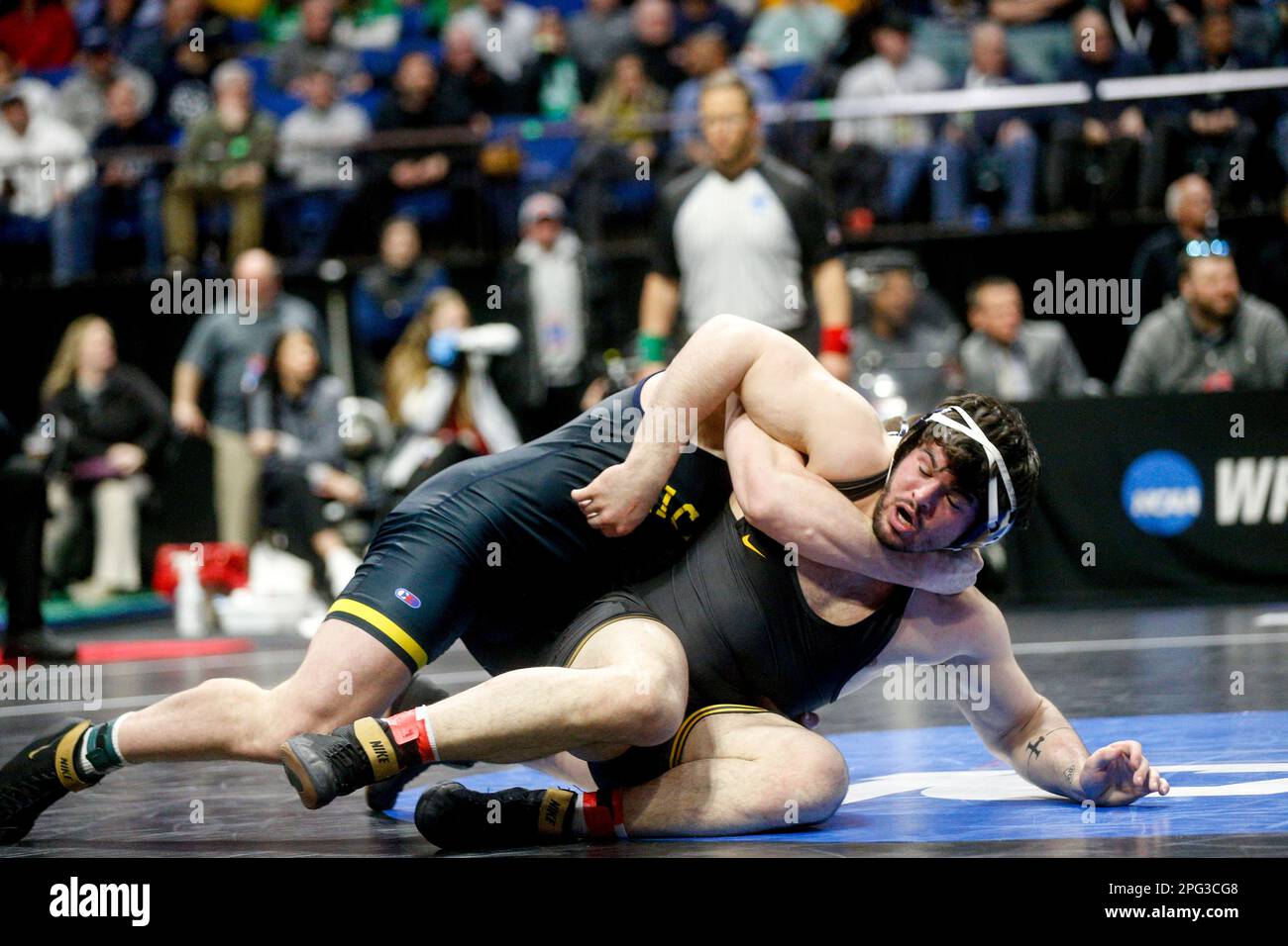Michigan's Mason Parris takes down Iowa's Tony Cassioppi during the ...