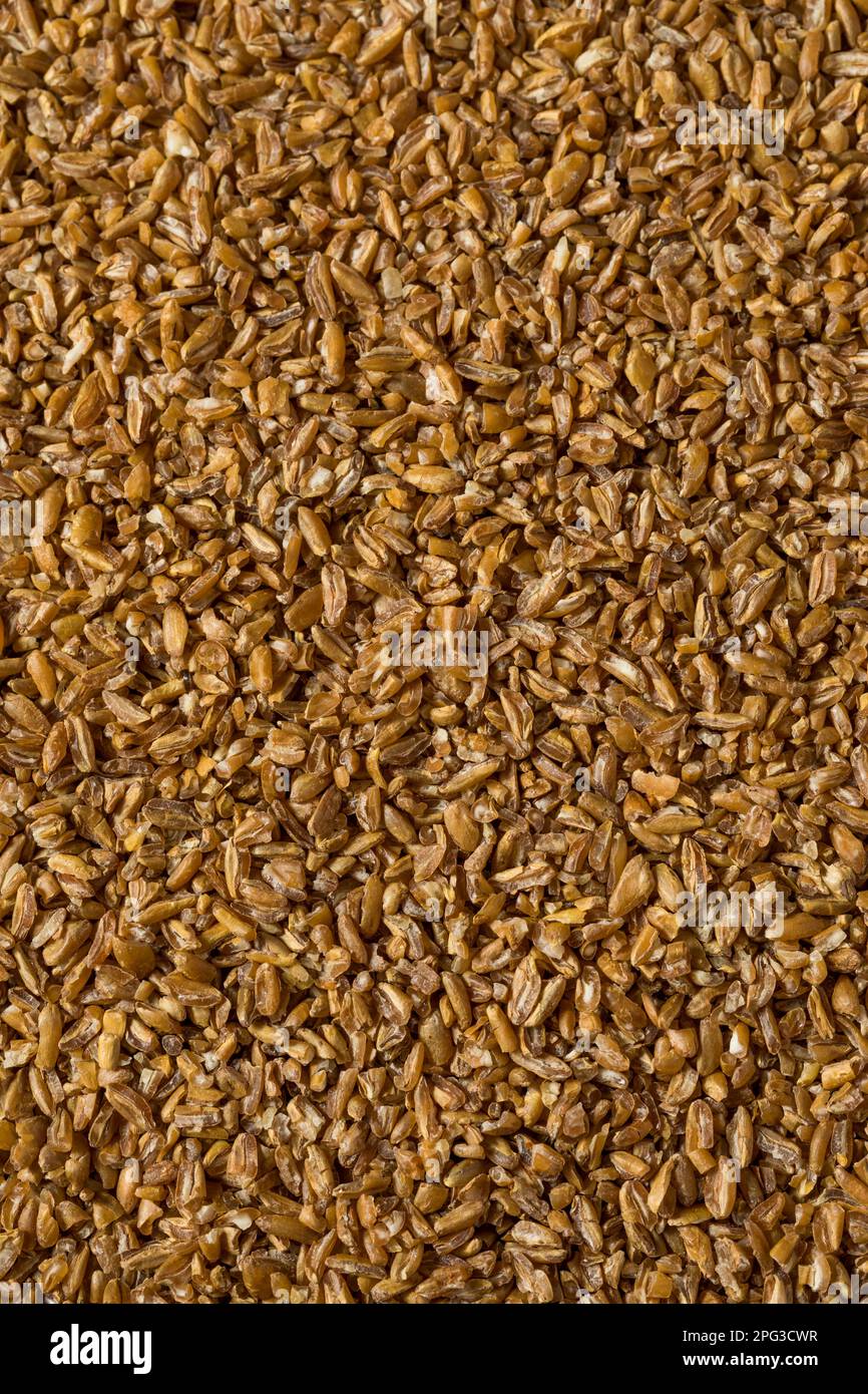 Raw Brown Organic Bulgar Wheat in a Bowl Stock Photo - Alamy