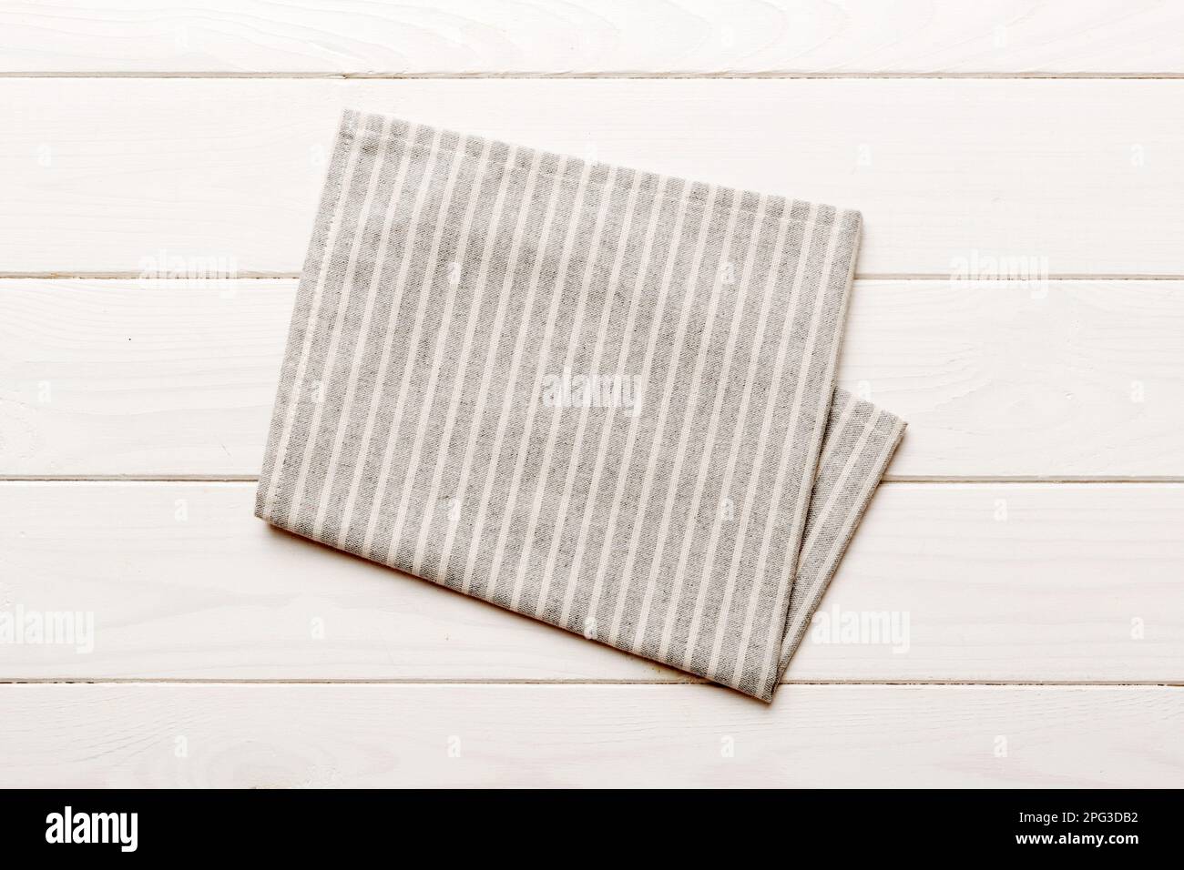 top view with gray kitchen napkin isolated on table background. Folded ...