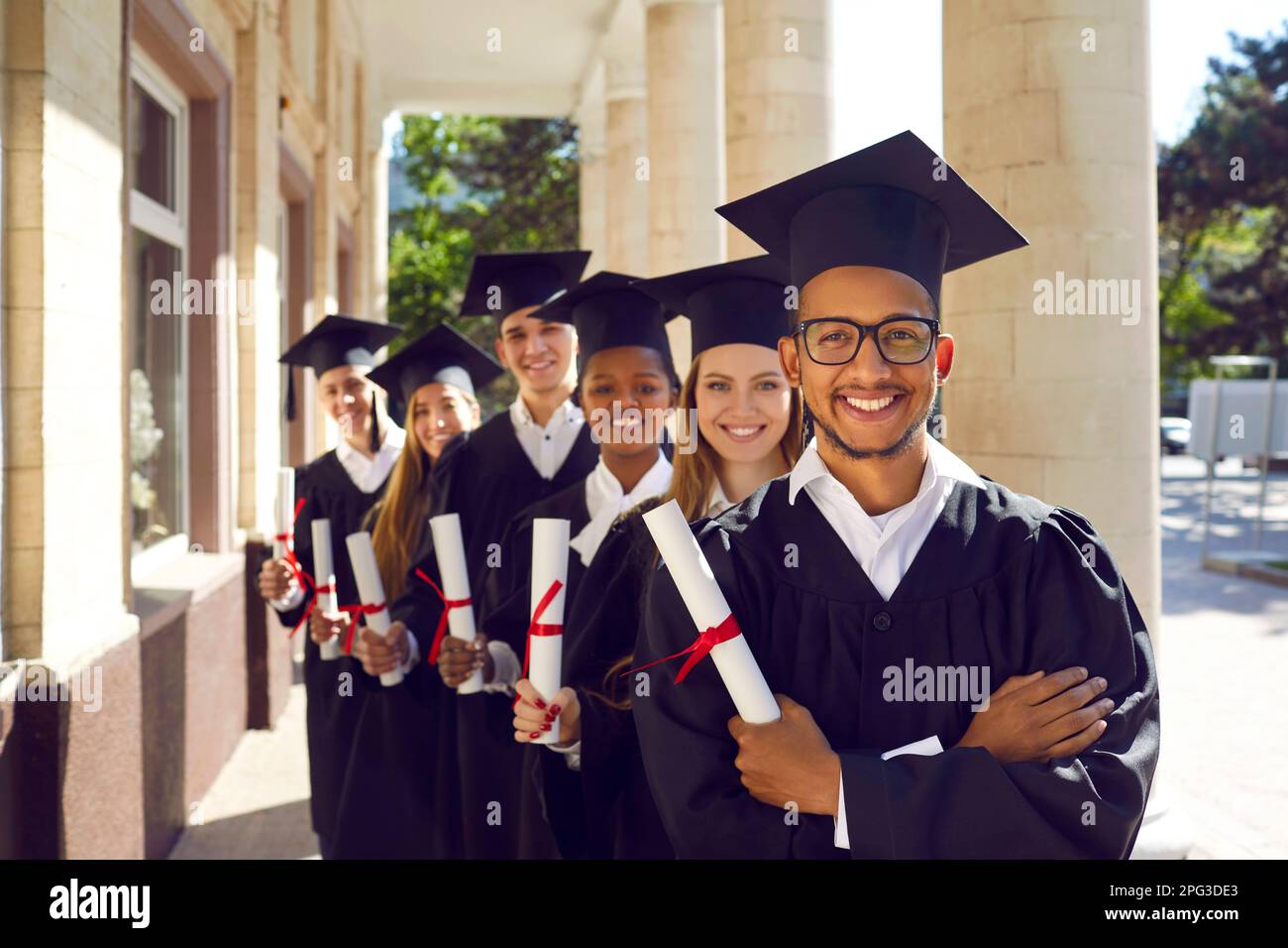 Groups Of Happy And Joyful Graduates In Academic Gowns And Academic