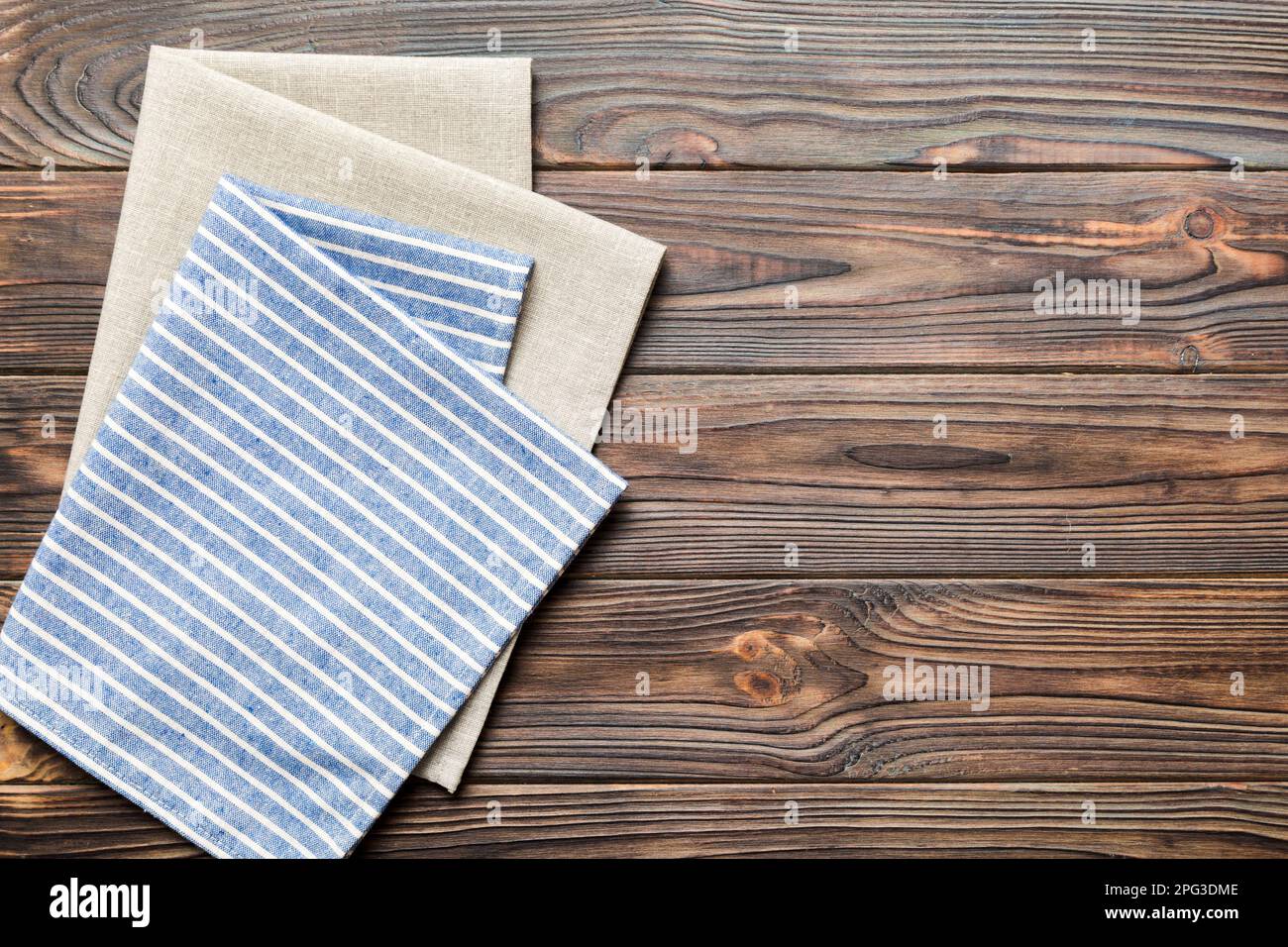 top view with blue kitchen napkin isolated on table background. Folded ...