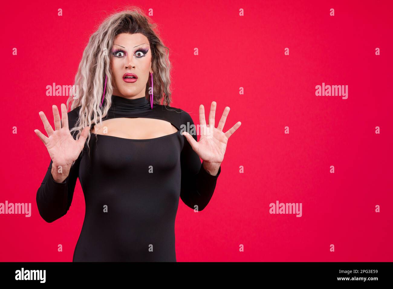 Surprised transgender person gesturing with the hands in fear Stock ...