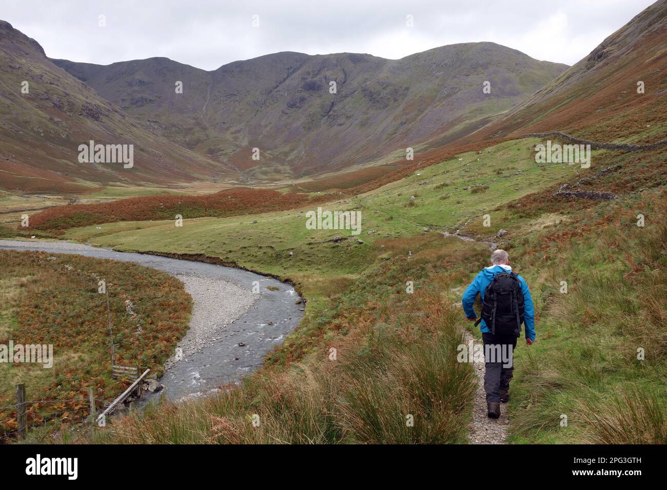 Man (Hiker) Walking by Mosedale Beck on the Black Sail Pass Path into ...