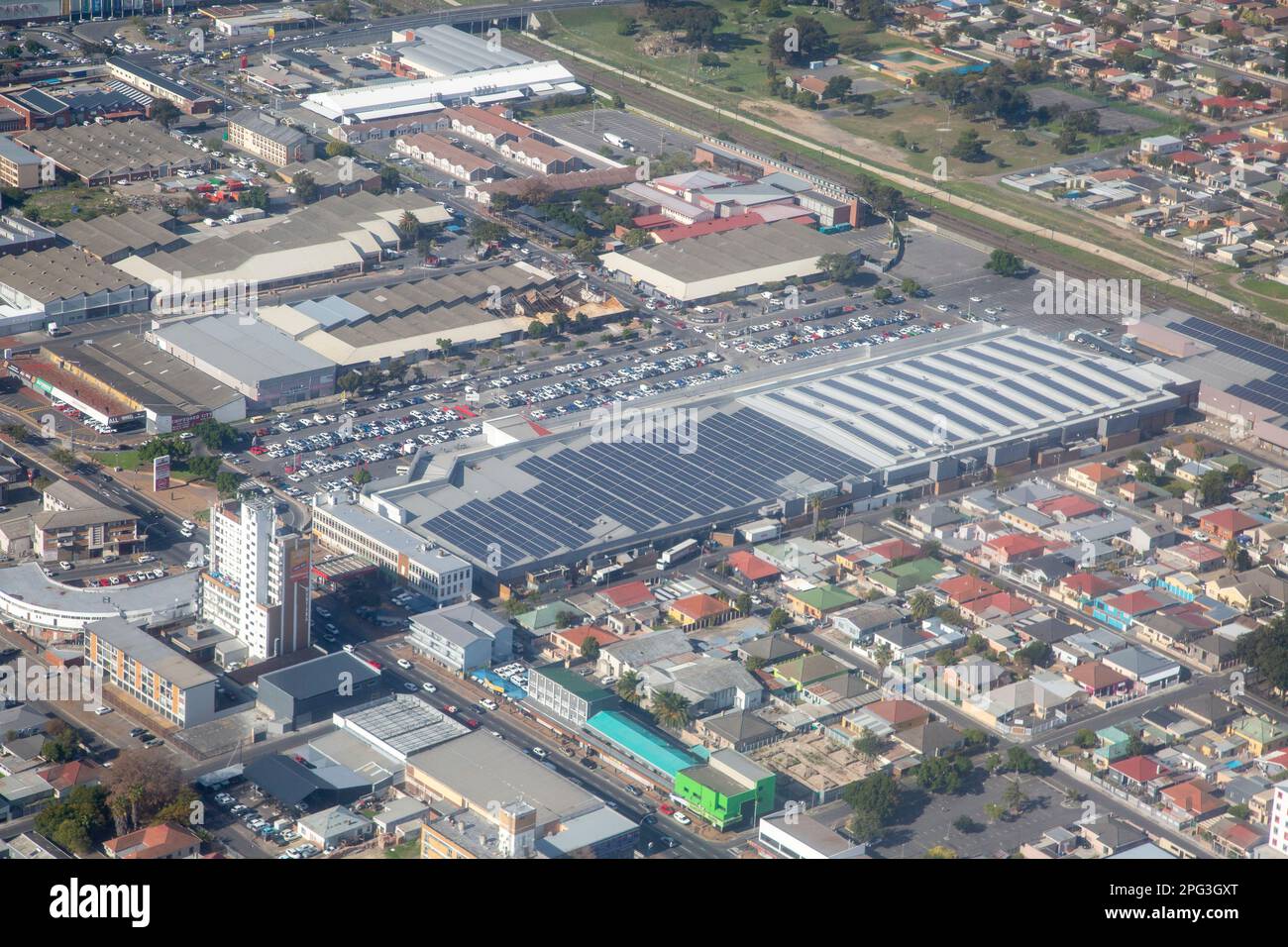 Aerial view of a mixed use urban area with a large shopping mall with ...