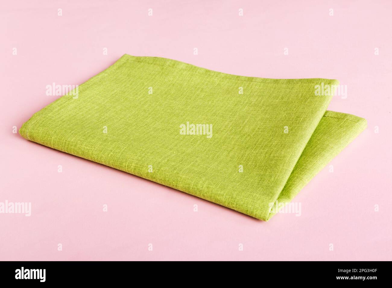 top view with green kitchen napkin isolated on table background. Folded ...