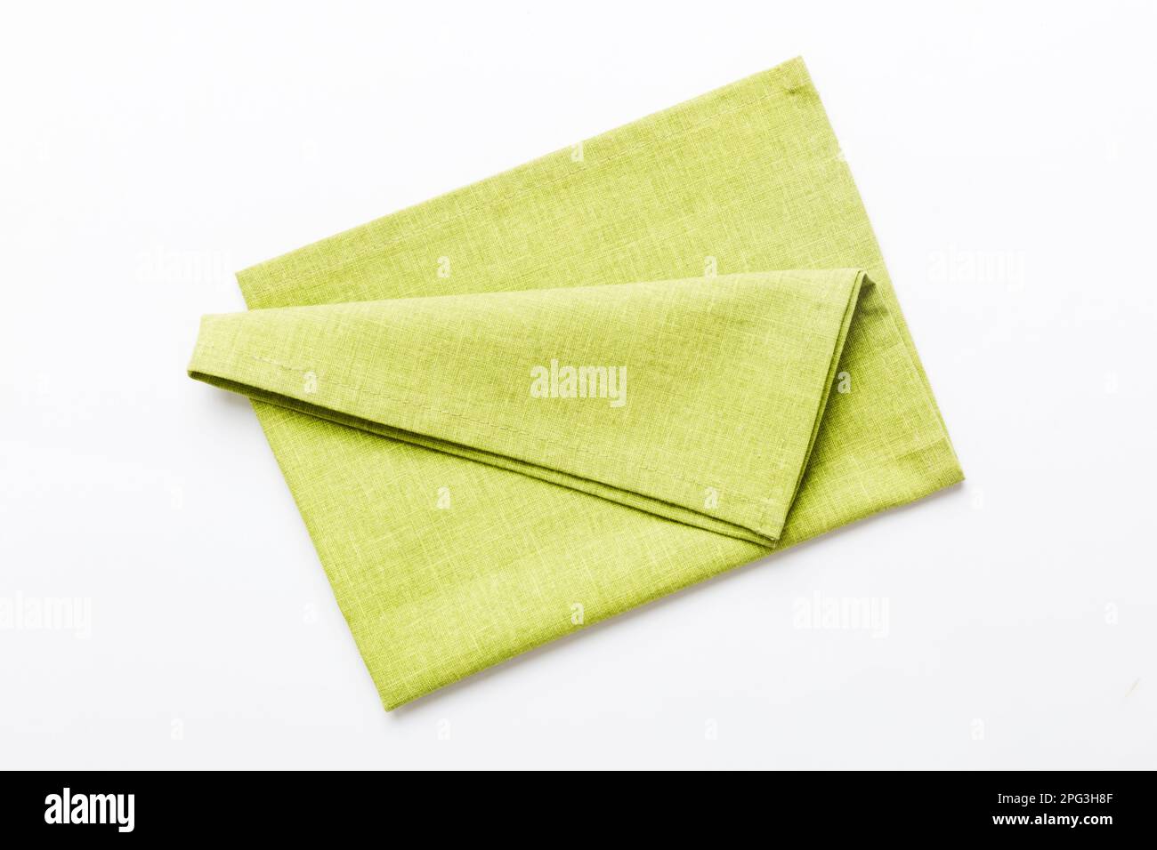 top view with green kitchen napkin isolated on table background. Folded ...