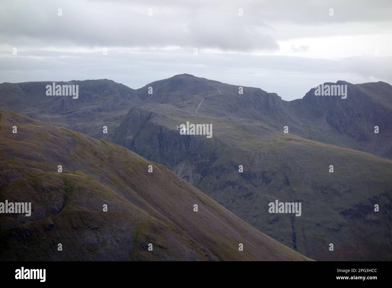 Low Flying Military Turboprop Cargo Plane Passing the Scafell Mountain ...