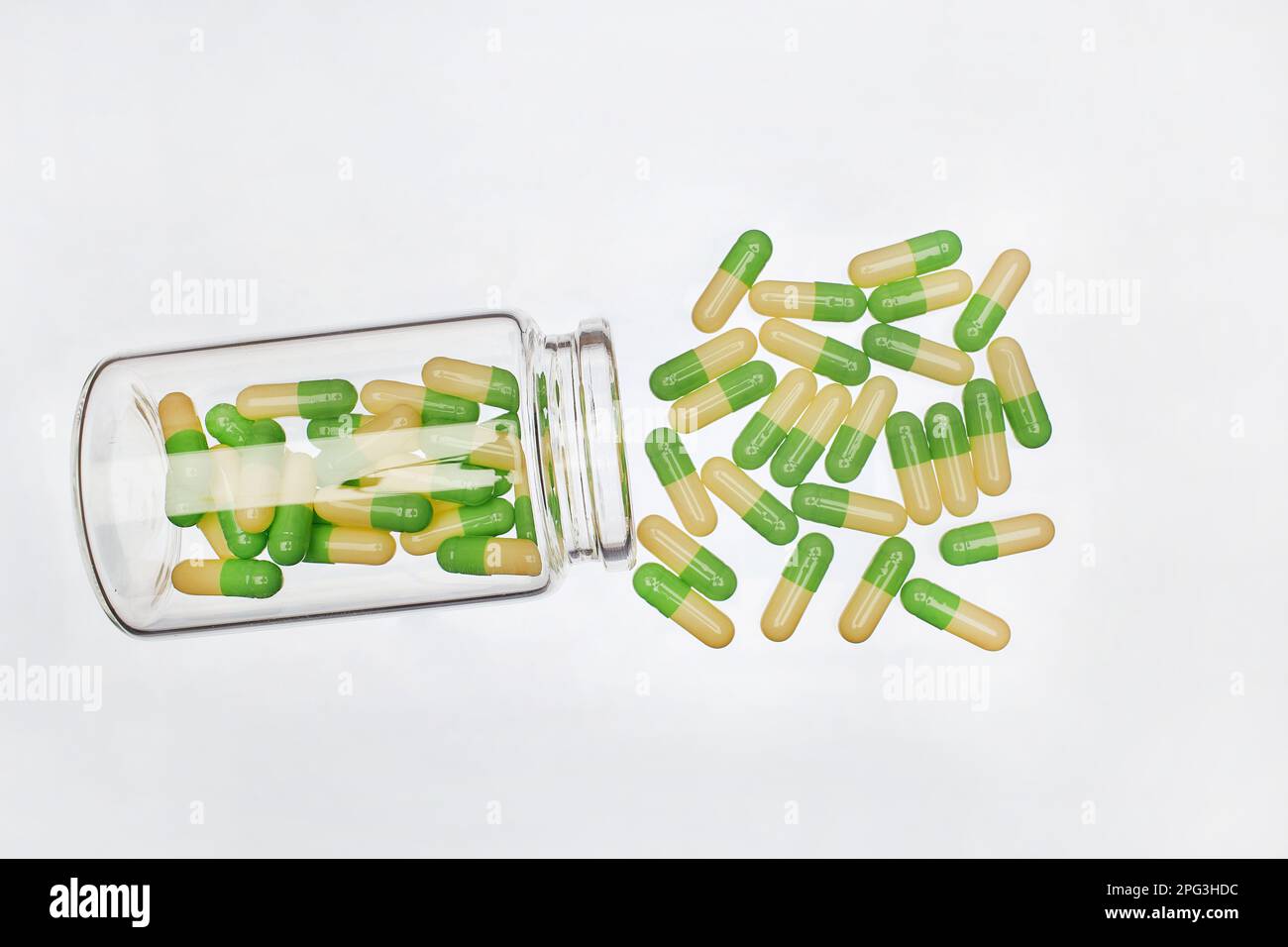 One semi-transparent bottle with capsules Stock Photo - Alamy