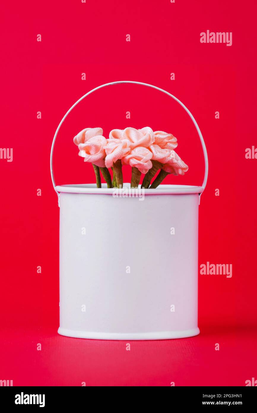 Pouring water red bucket hi-res stock photography and images - Alamy