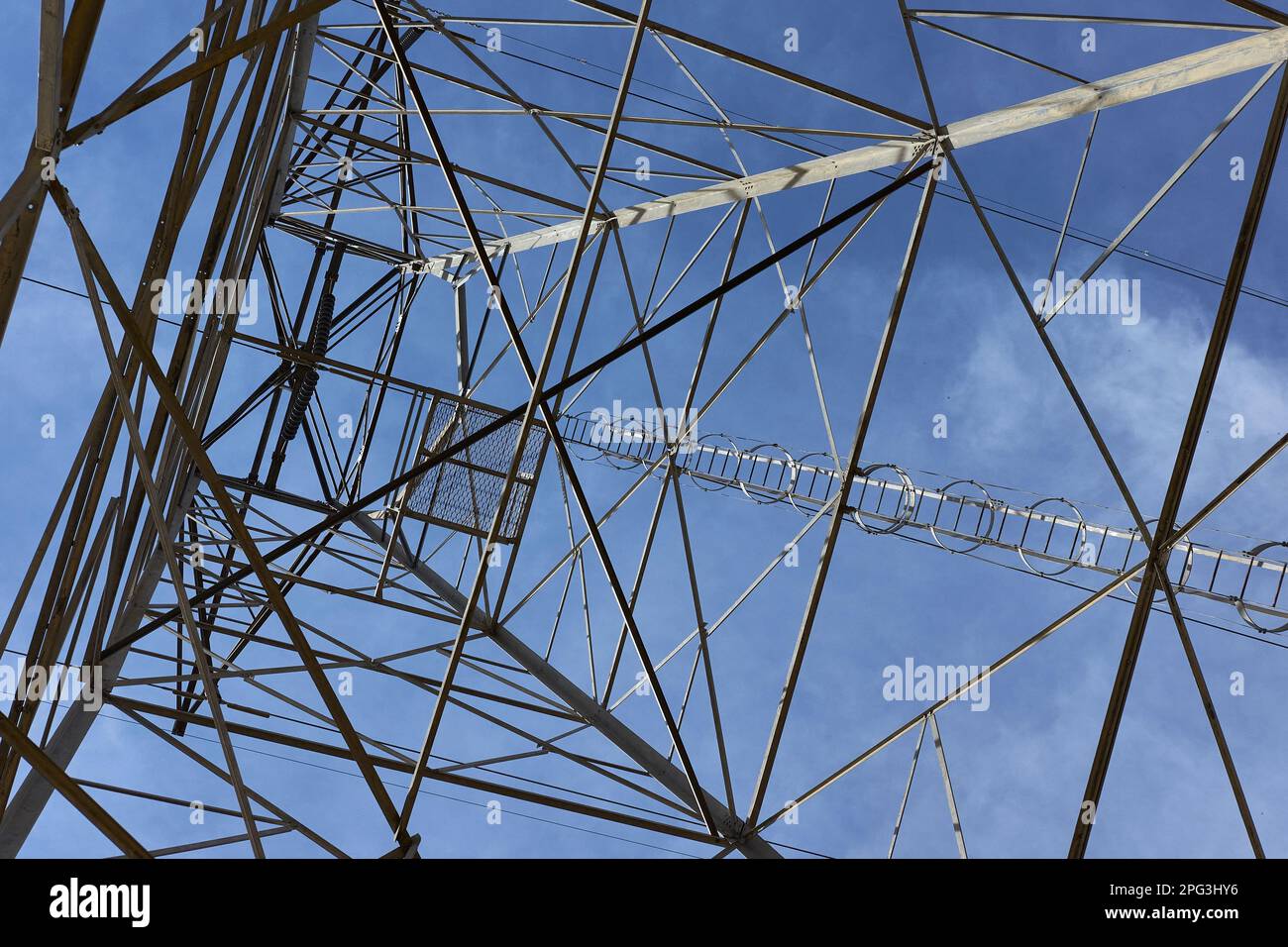 Electric power transmission tower structure seen from below Stock Photo ...