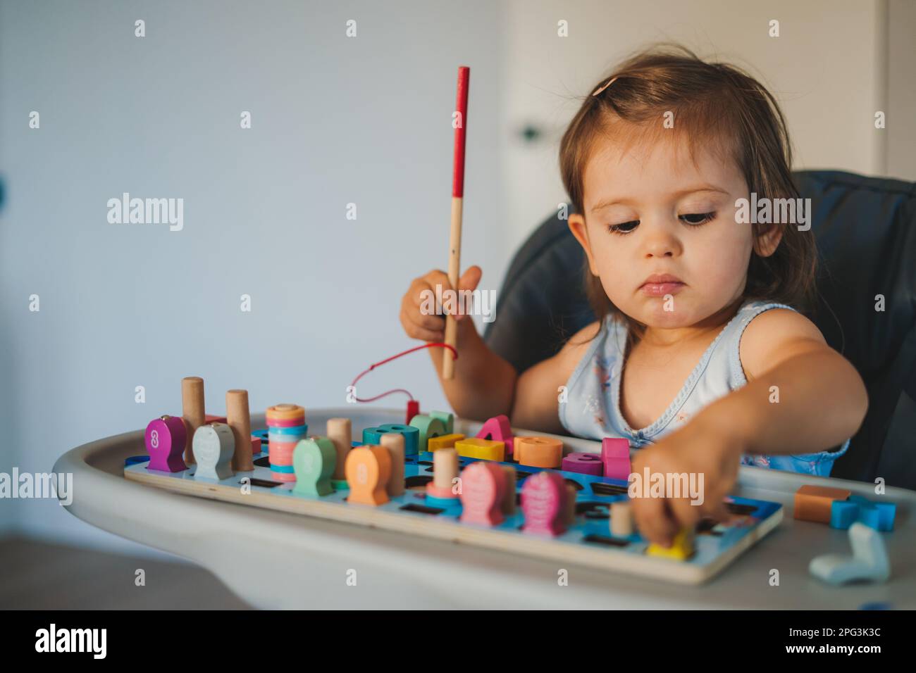 Baby kid playing with wooden alphabet letters board on table playing ...