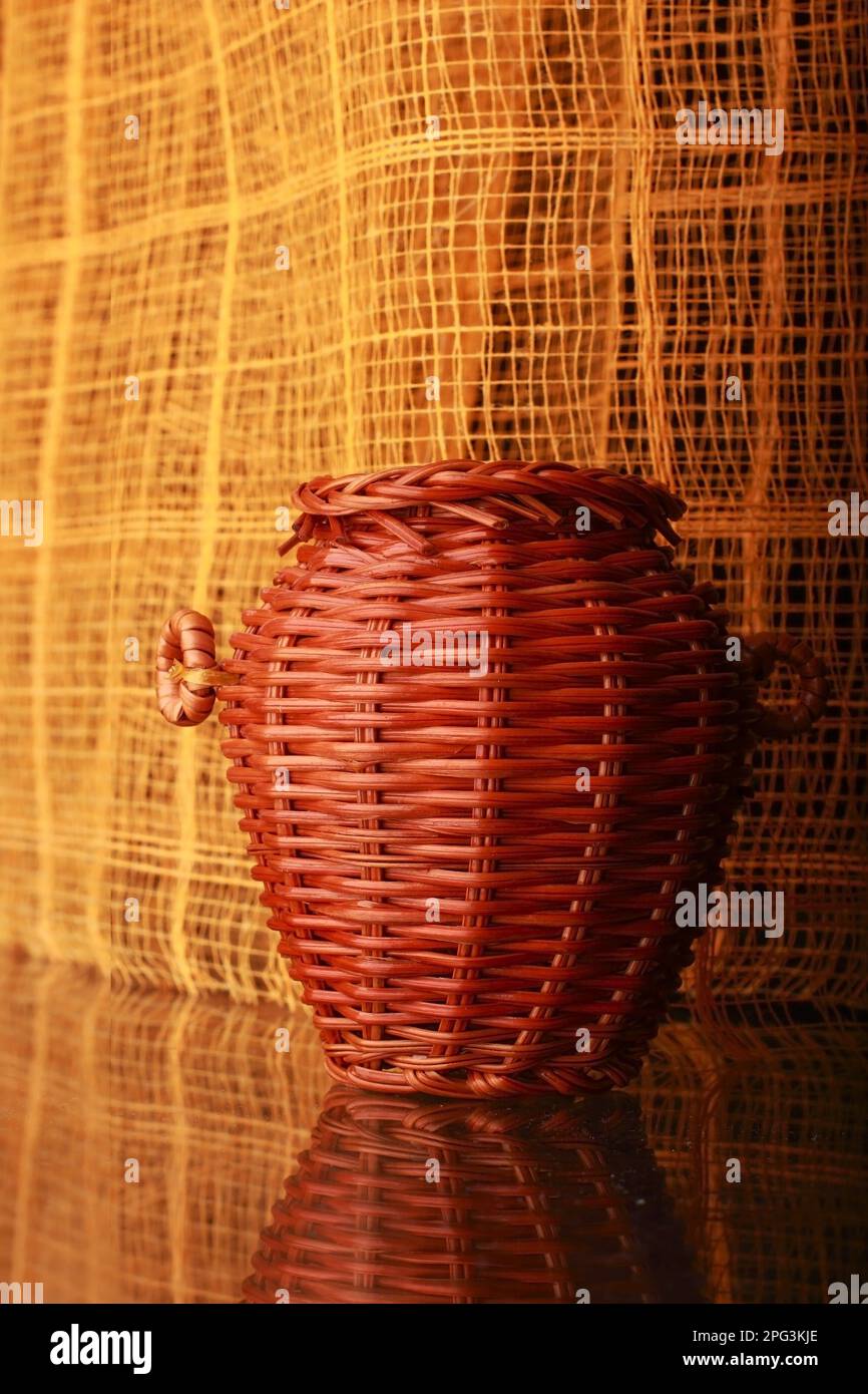 ancient rods basken on orange background Stock Photo - Alamy