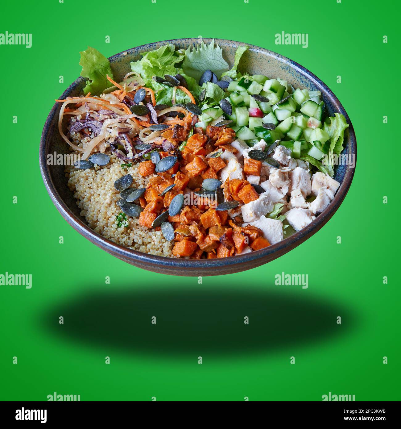 Floating Poke in bowl on green gradient background Stock Photo - Alamy