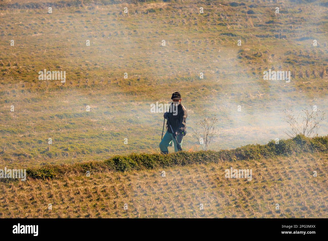 Hyogo, Japan - February 5, 2023: Fire fighter wearing mask uses ...