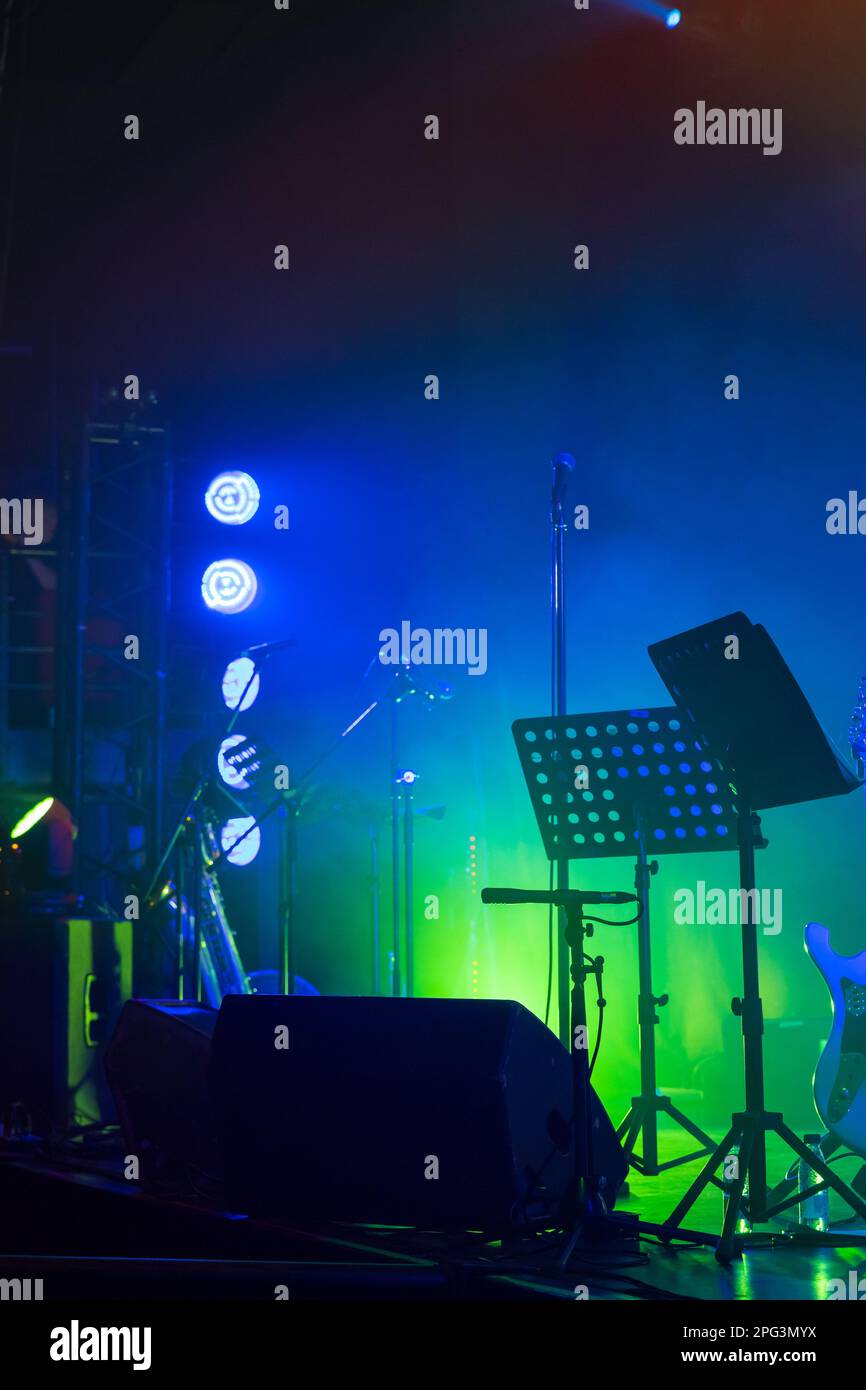 Vertical performance scene background photo with colorful spot lights ...