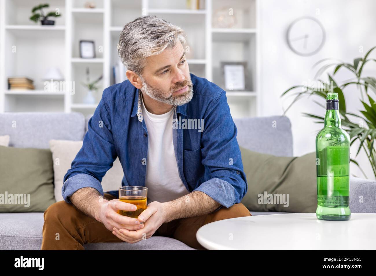 Sad drunken businessman sitting hi-res stock photography and images - Alamy
