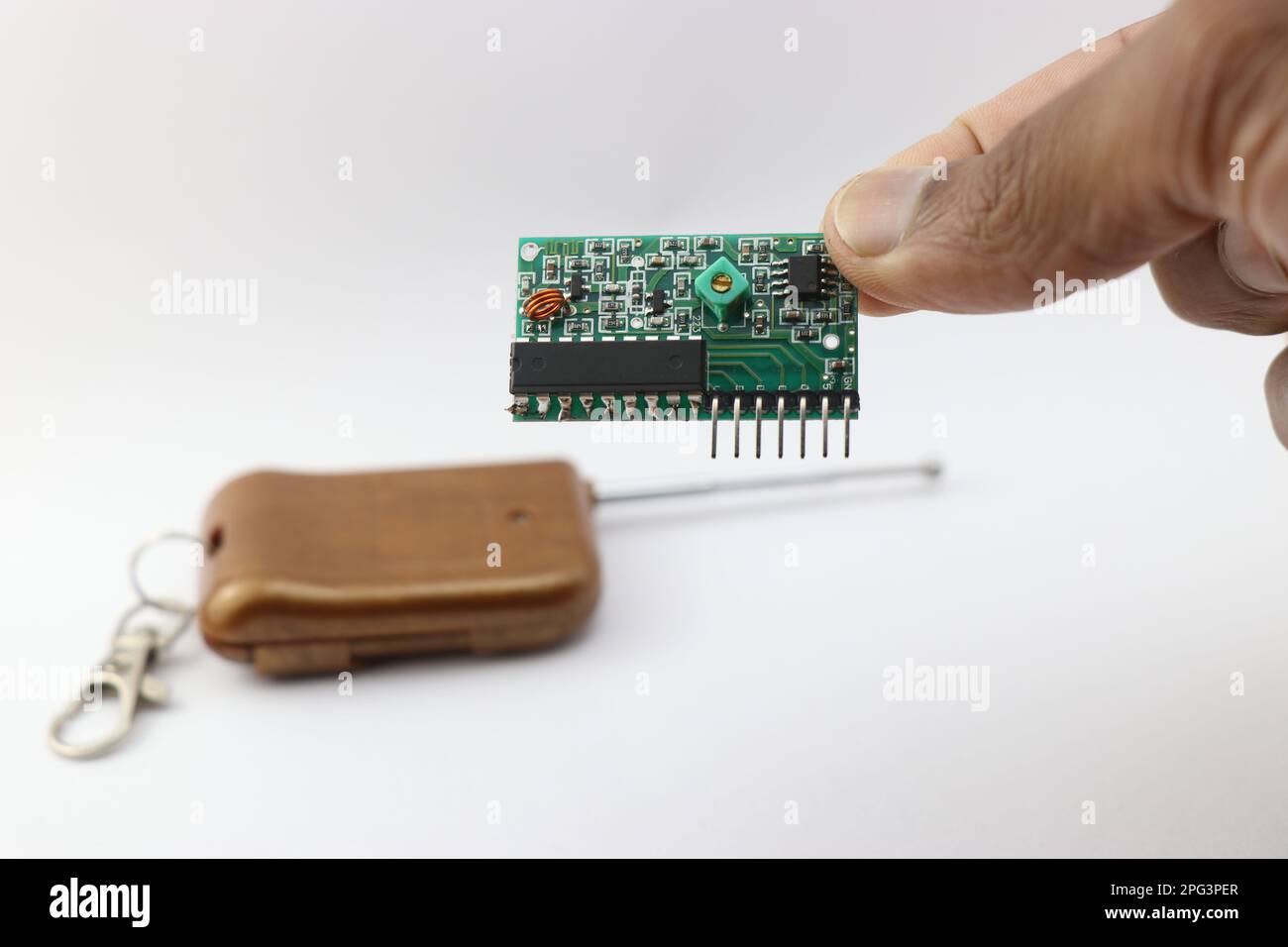 Wireless remote control receiver circuit held in the hand Stock Photo ...