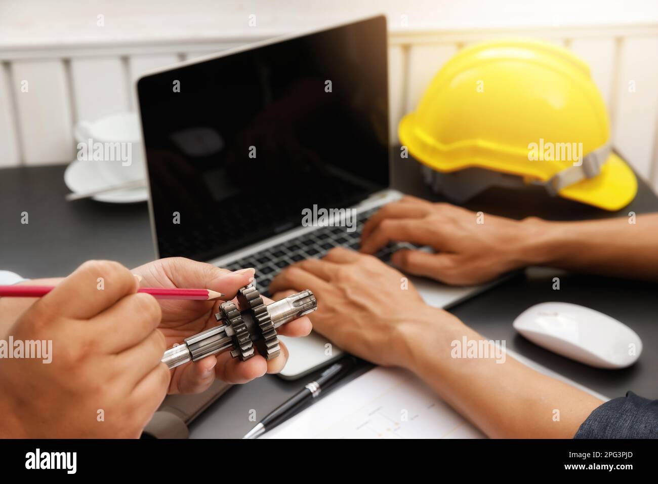 The engineering team is working on their project together. Man work ...