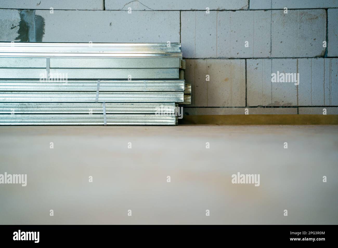 A packed metal profile lies on the floor at a construction site close ...