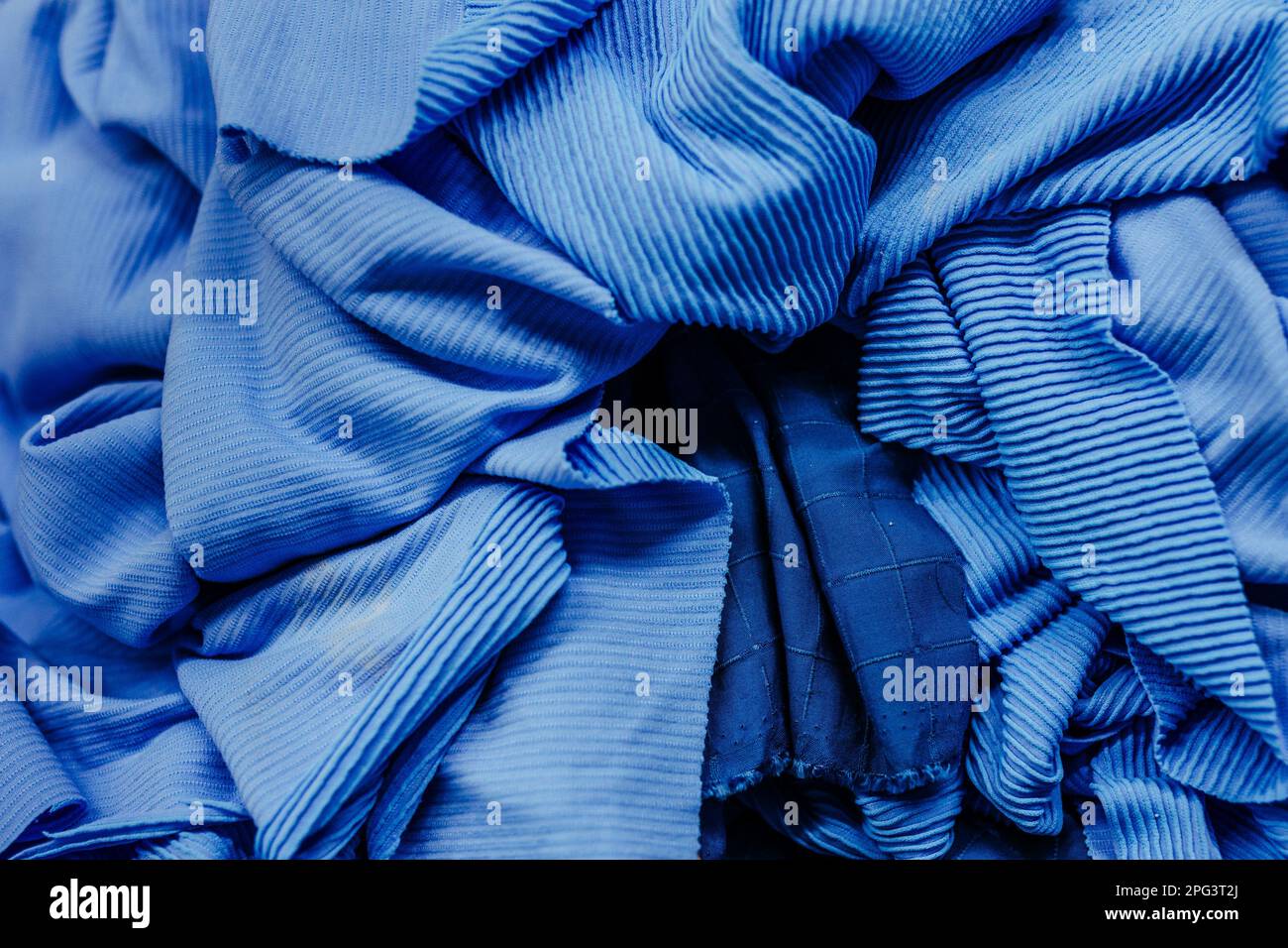 A closeup of soft blue fabric swatches background Stock Photo - Alamy