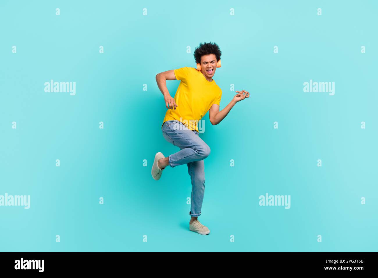 Full size photo of overjoyed careless young man have fun listen music ...