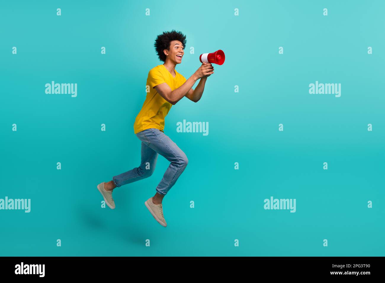 Full body profile photo of excited man jump rush empty space hold toa ...