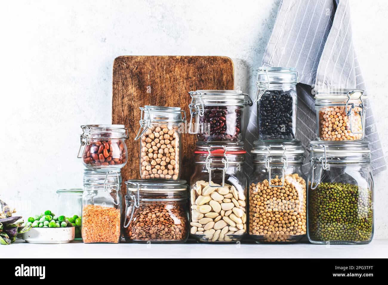 Legumes and beans set in jars. Dried, raw and fresh. Lentils, chickpeas ...