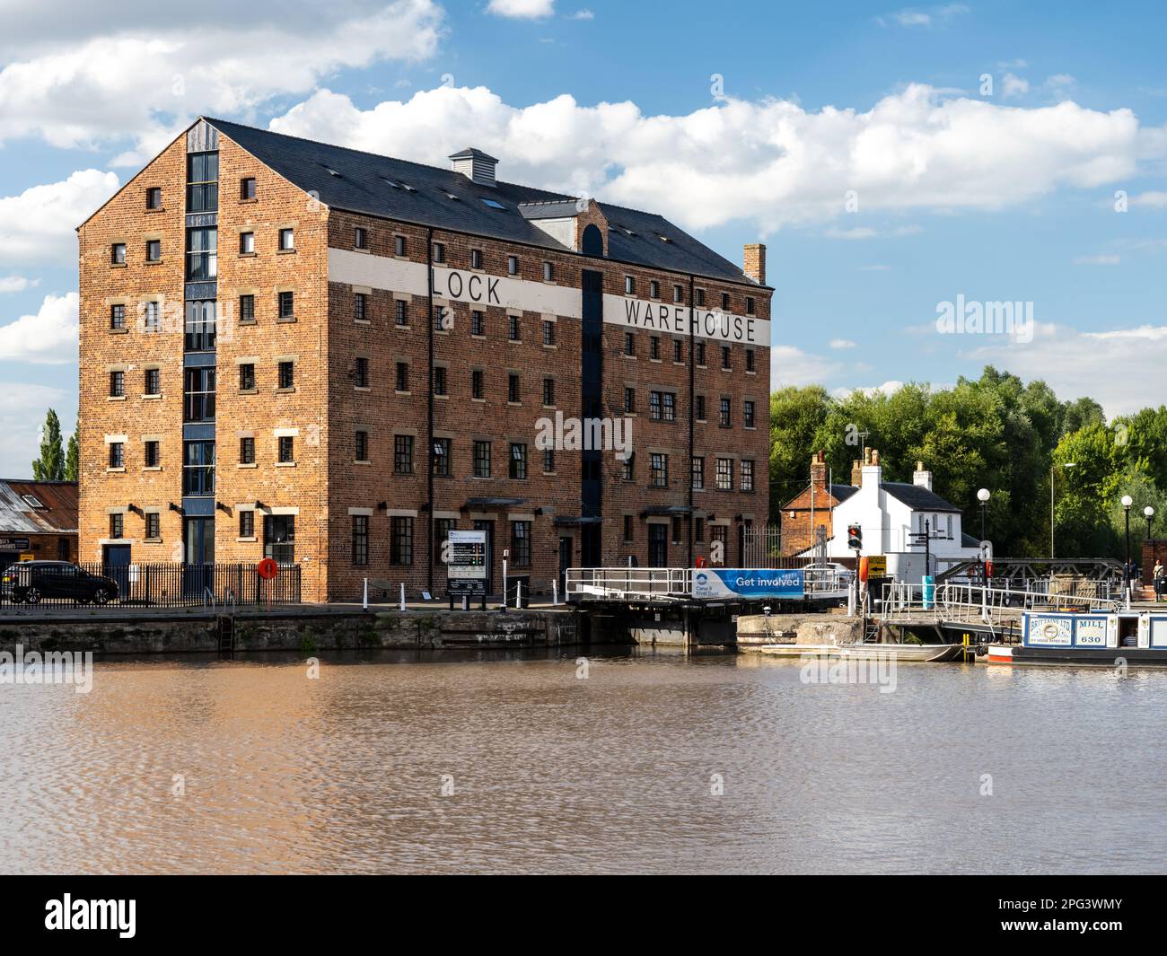 A Victorian brick warehouse stands beside the lock gates of Gloucester ...