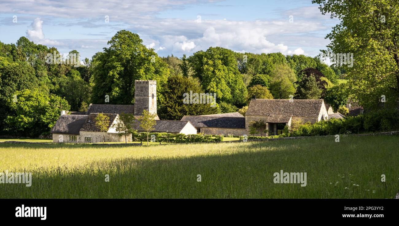 Sun shines on the tower of the traditional village church of St Andrew ...