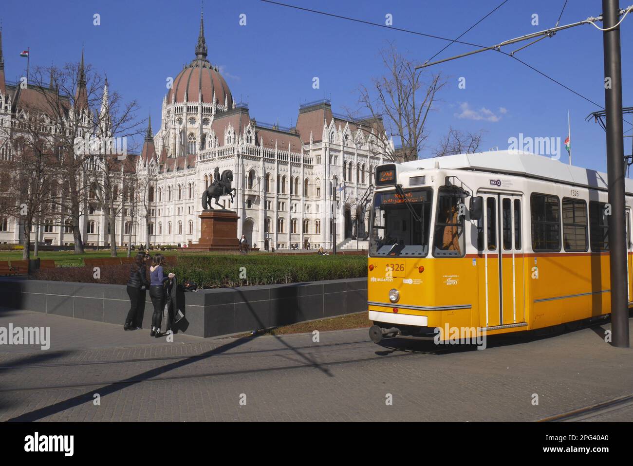 A tram runs past the neo-gothic Parliament building in Kossuth ter ...