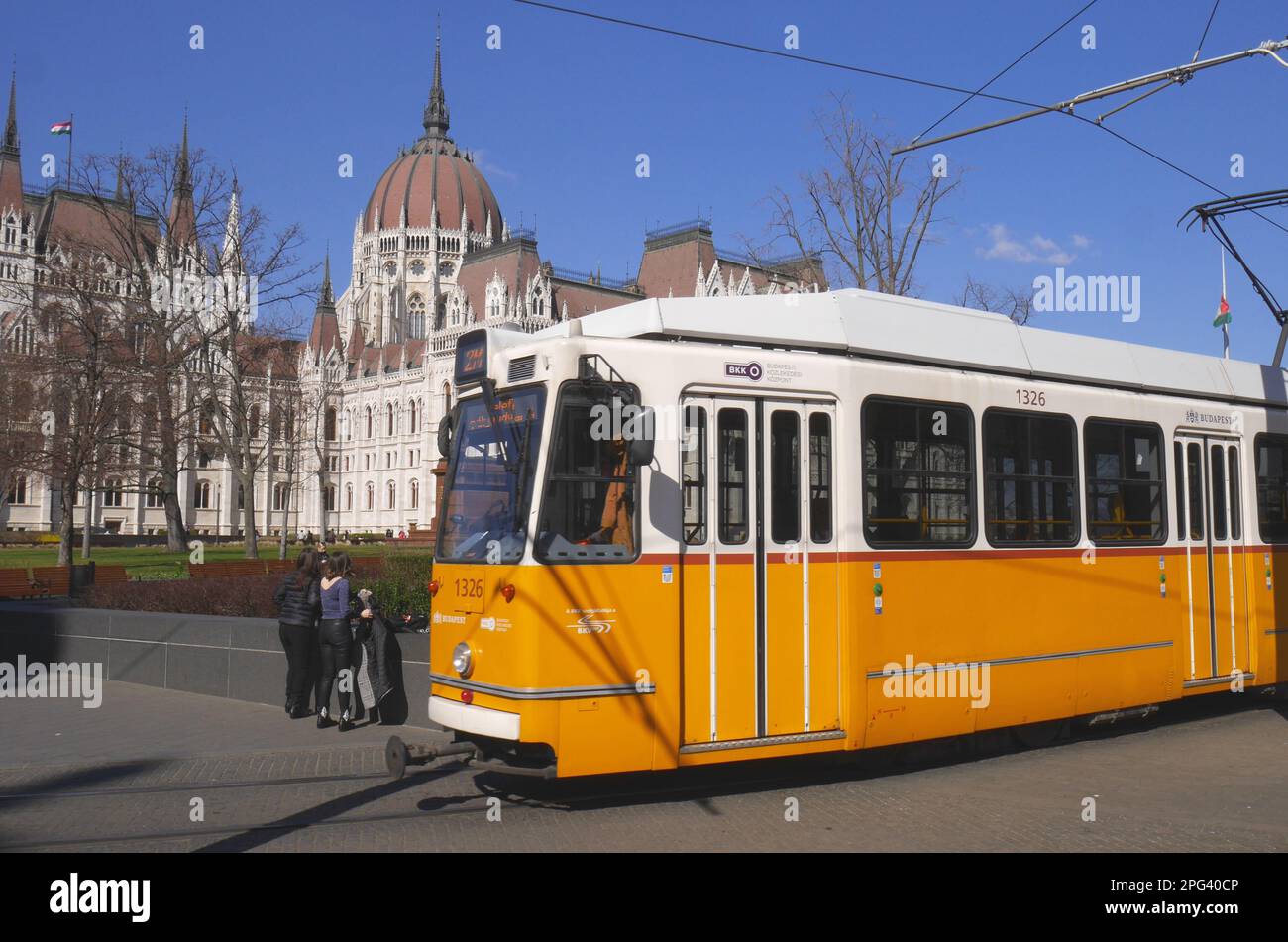 A tram runs past the neo-gothic Parliament building in Kossuth ter ...