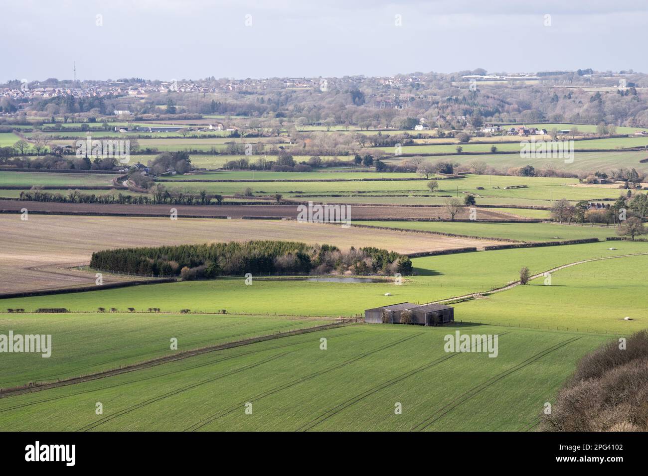 Fields of crops and pasture cover the rolling landscape around ...