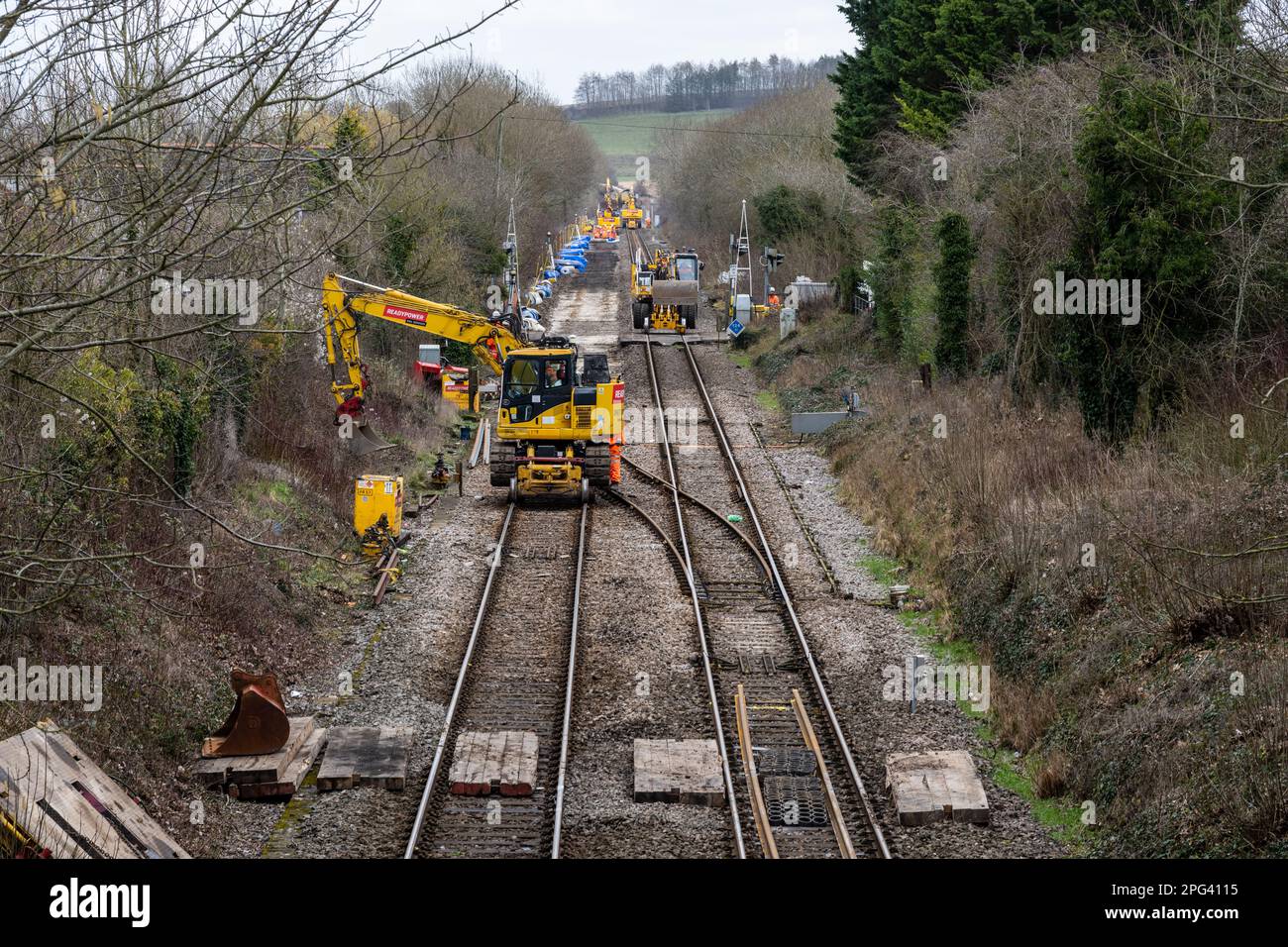 Workmen and track machinery at a work shite in Wiltshire where track ...