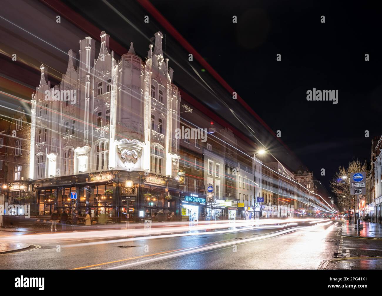 Traffic passes the distinctive Art Nouveau exterior of the Rising Sun ...