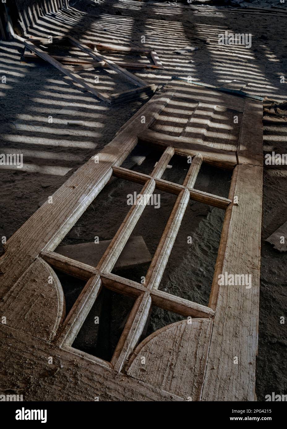 A fallen door lies in the old community hall of the diamond ghost town ...