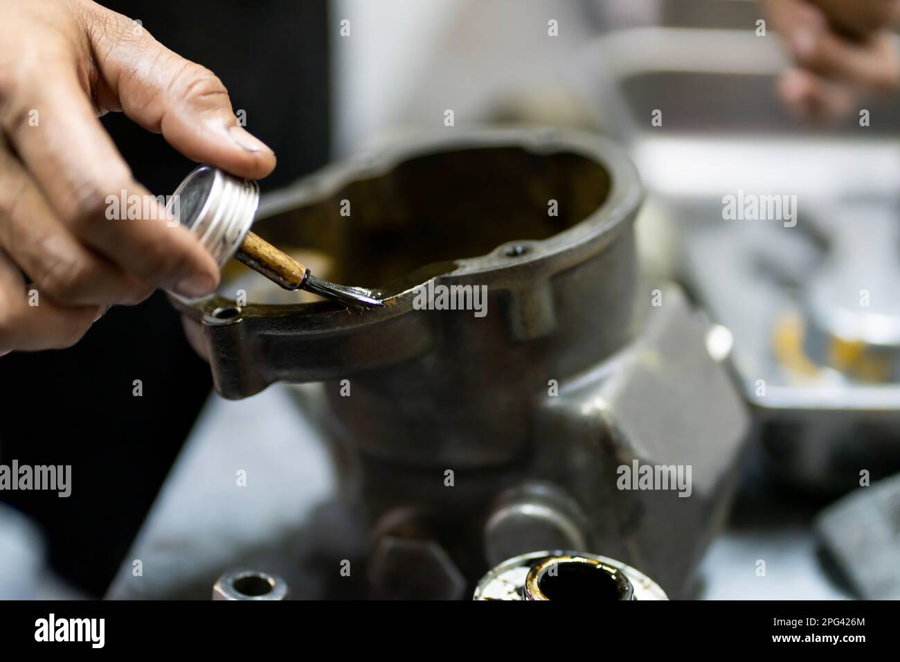 Close-up photos of assembling engine parts or machines that have ...