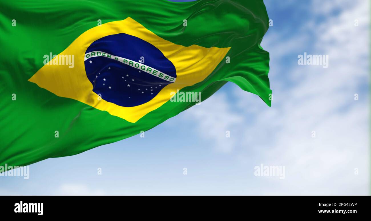Brazil national flag waving on a clear day. Yellow diamond on green ...