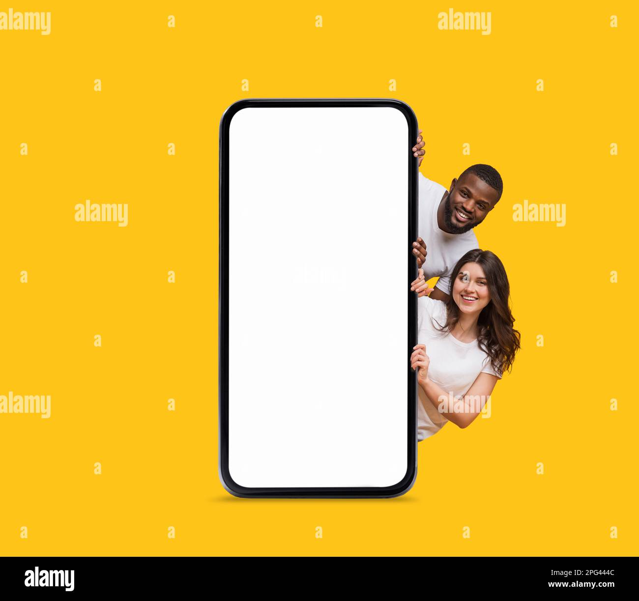 Mobile Mockup. Happy Interracial Couple Peeking Out Behind Big Blank ...