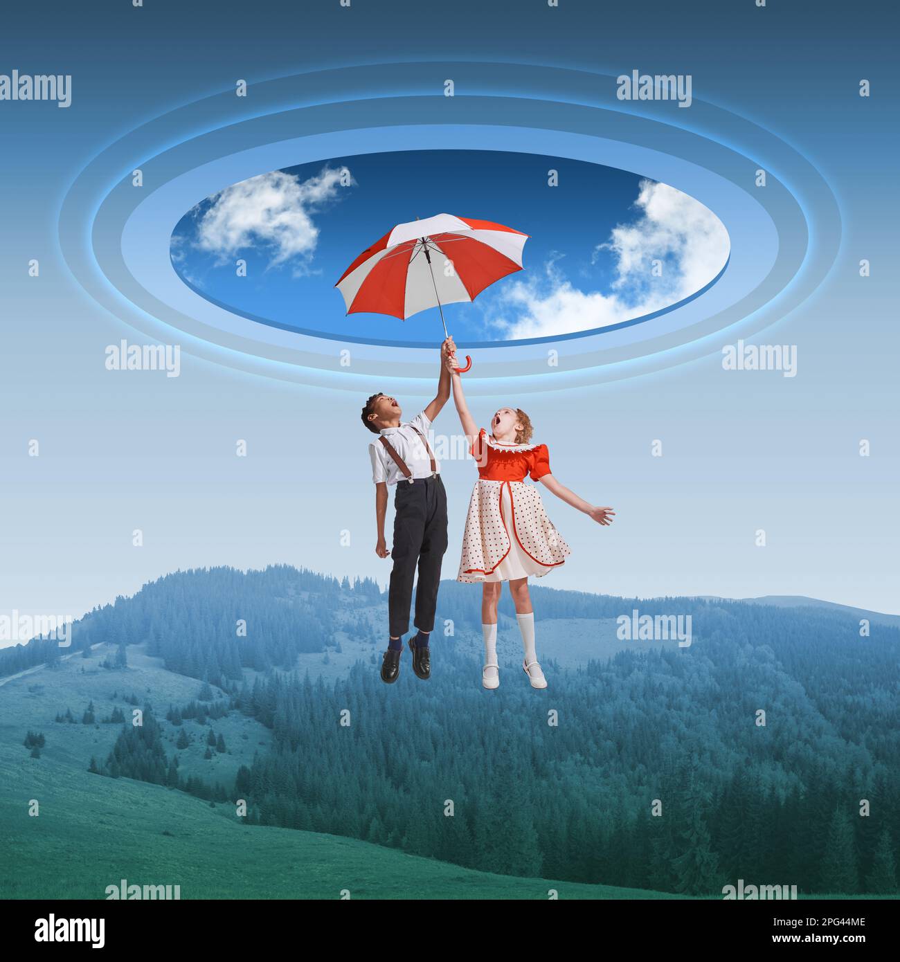 Two happy playful kids, boy and girl playing, flying with umbrella over ...
